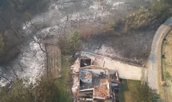 Cemetery burned as Greek wildfires sweep through villages